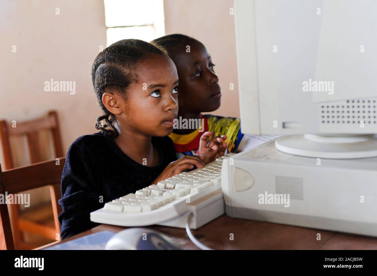 Children's computer class. Young Masai children in an introductory ...