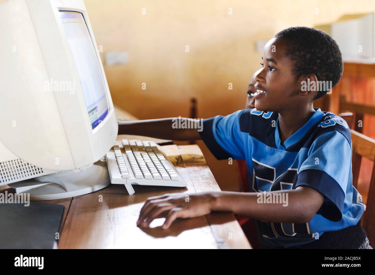 Children's computer class. Young Masai children in an introductory ...