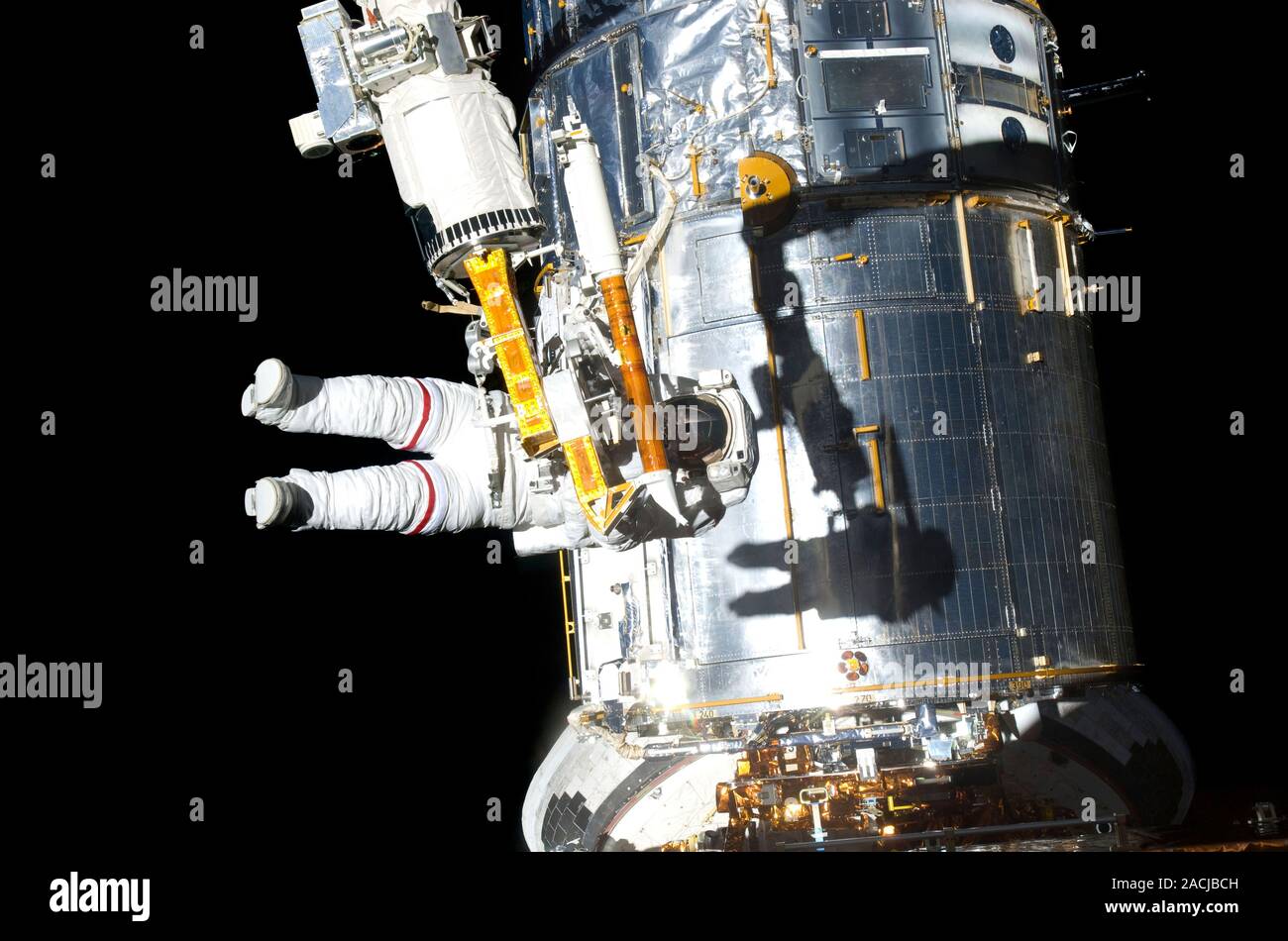 Hubble servicing. Astronaut John Grunsfeld during extravehicular ...