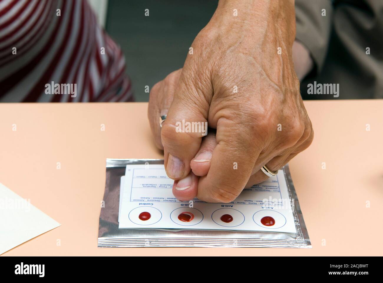 Blood type diet test. Test card and samples being used to determine a ...