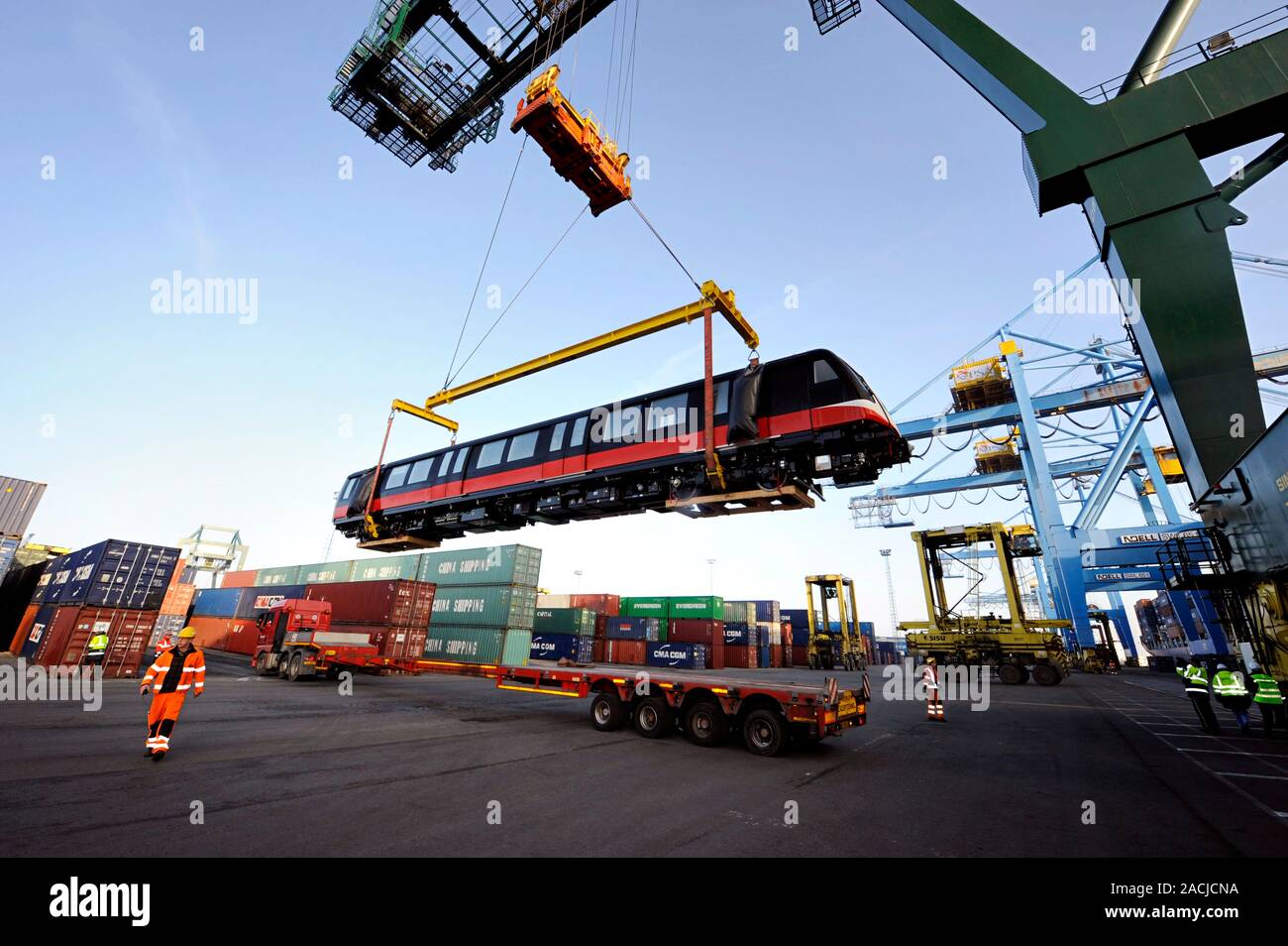 Singapore subway delivery. Shipping crane being used to lift a carriage ...