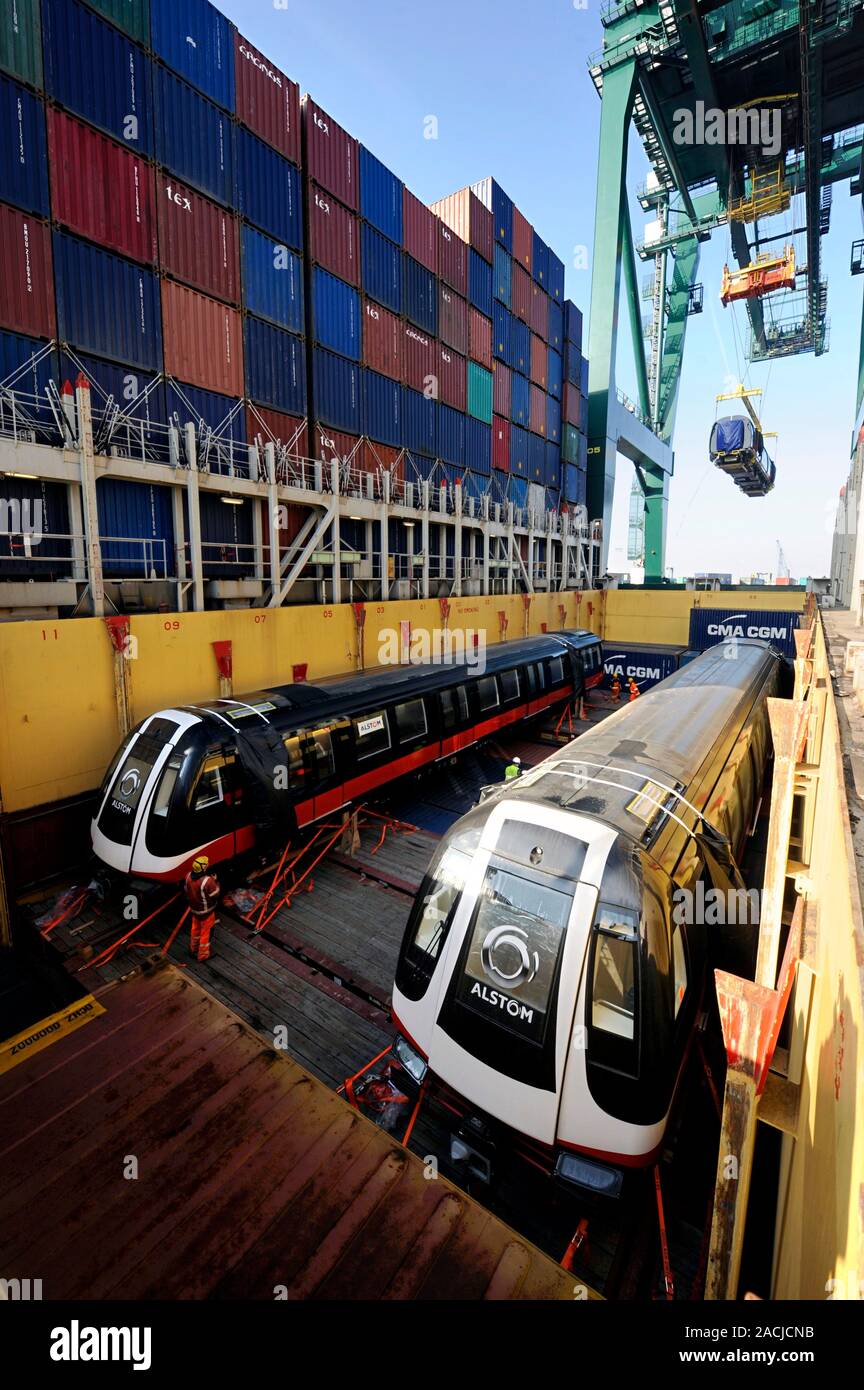 Singapore subway delivery. Shipping crane being used to load carriages ...