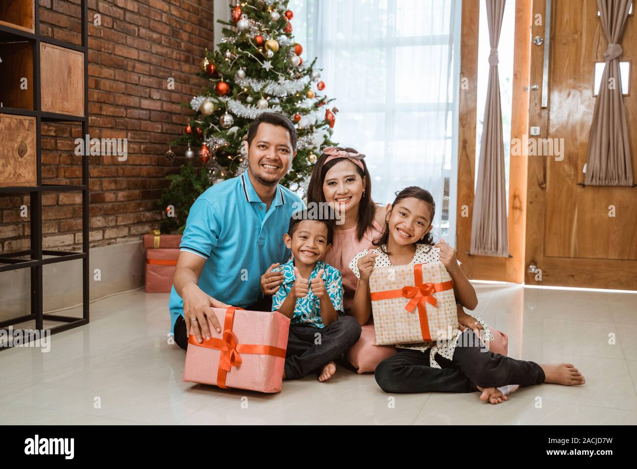 family and kids enjoy their christmas day together Stock Photo - Alamy