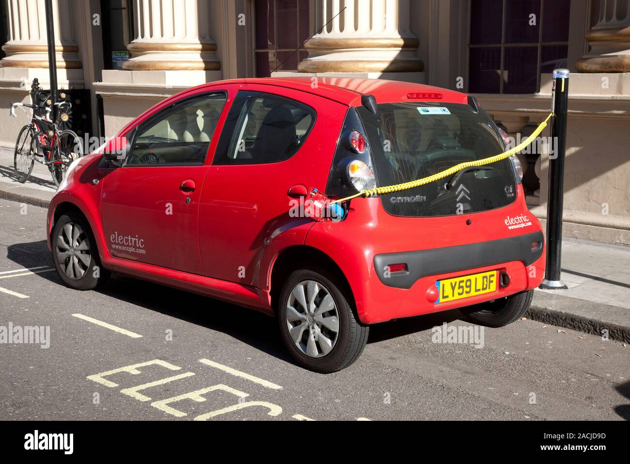 Recharging an electric car. Electric cars run on electricity, rather ...