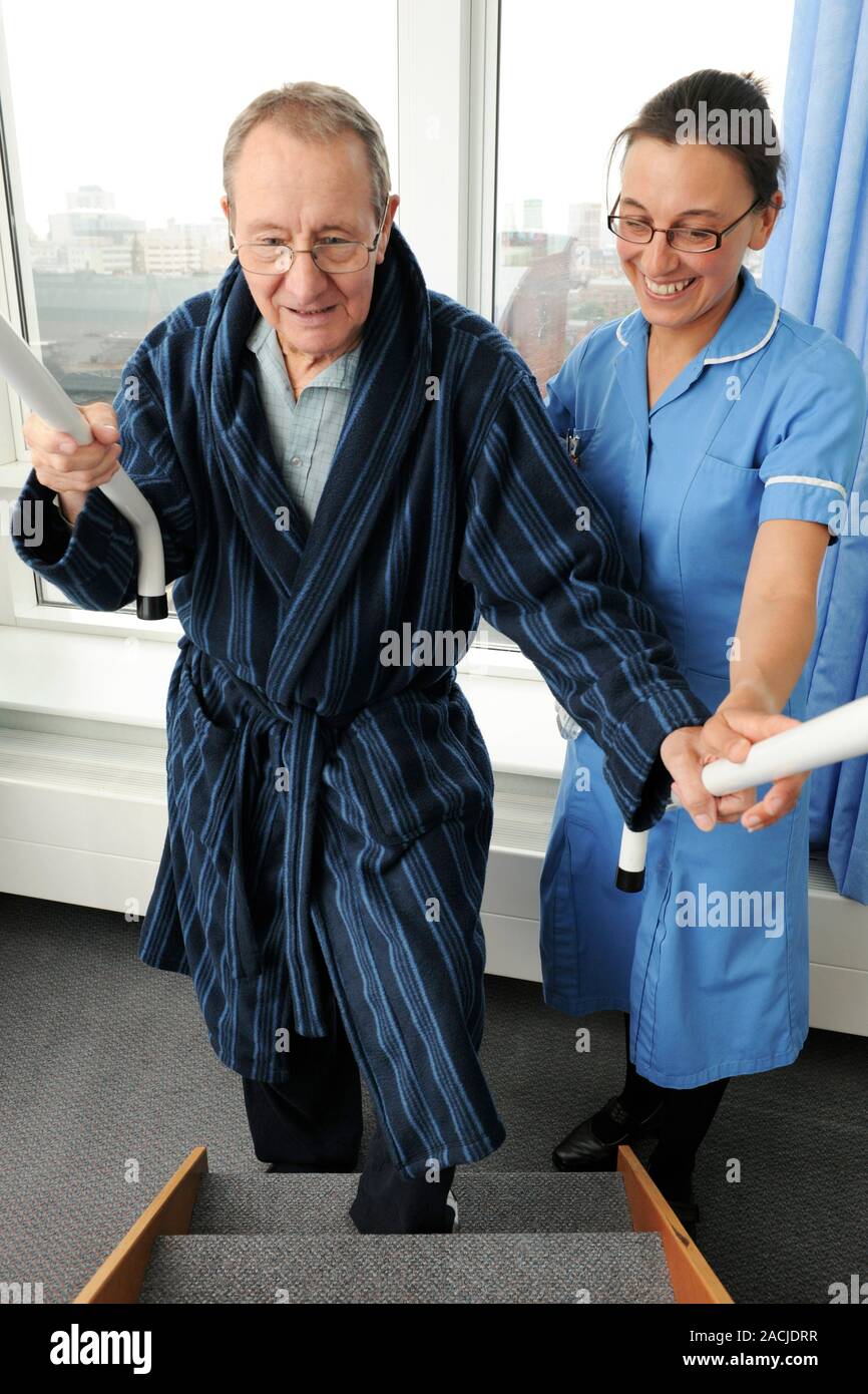Rehabilitation therapy. Nurse helping a patient to climb steps Stock ...