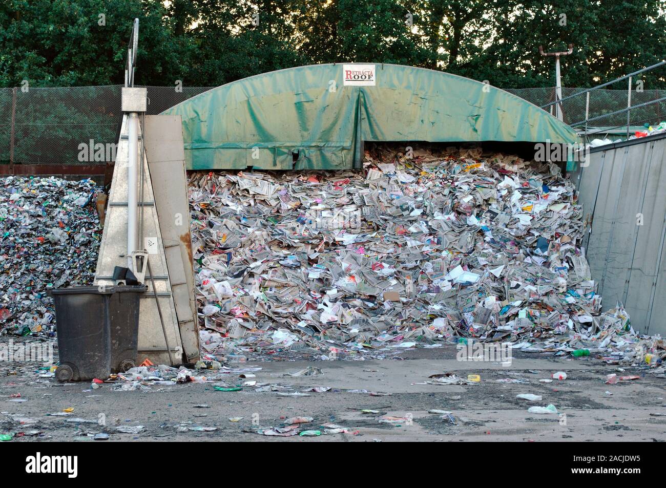 Newspaper recycling. Large pile of waste paper (mostly newspapers) at a ...