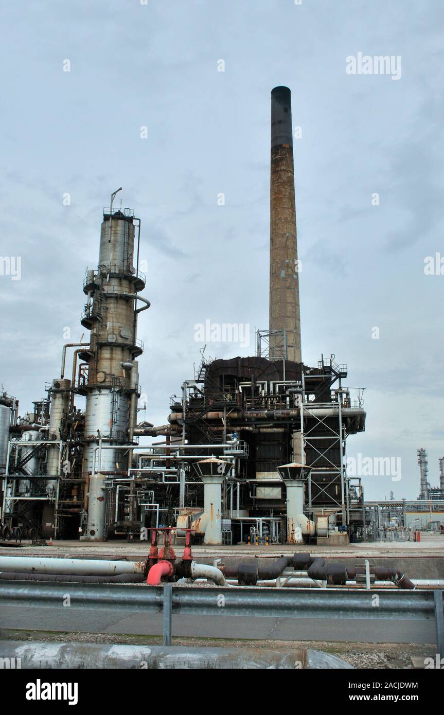 Oil refinery. Crude oil, or partially refined oil, is refined here into ...