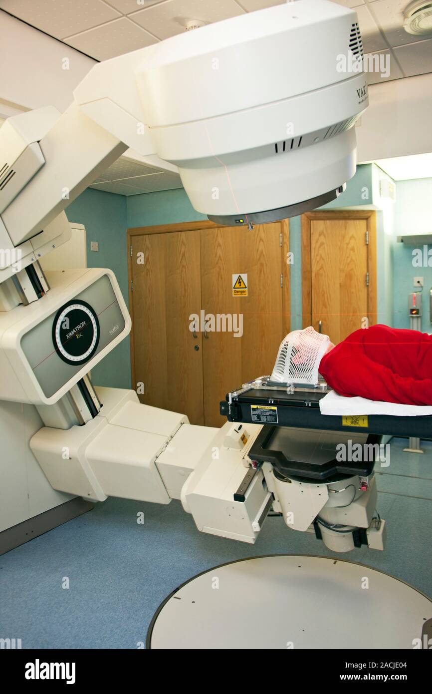 Radiotherapy simulator. Patient on an X-ray machine used to plan ...