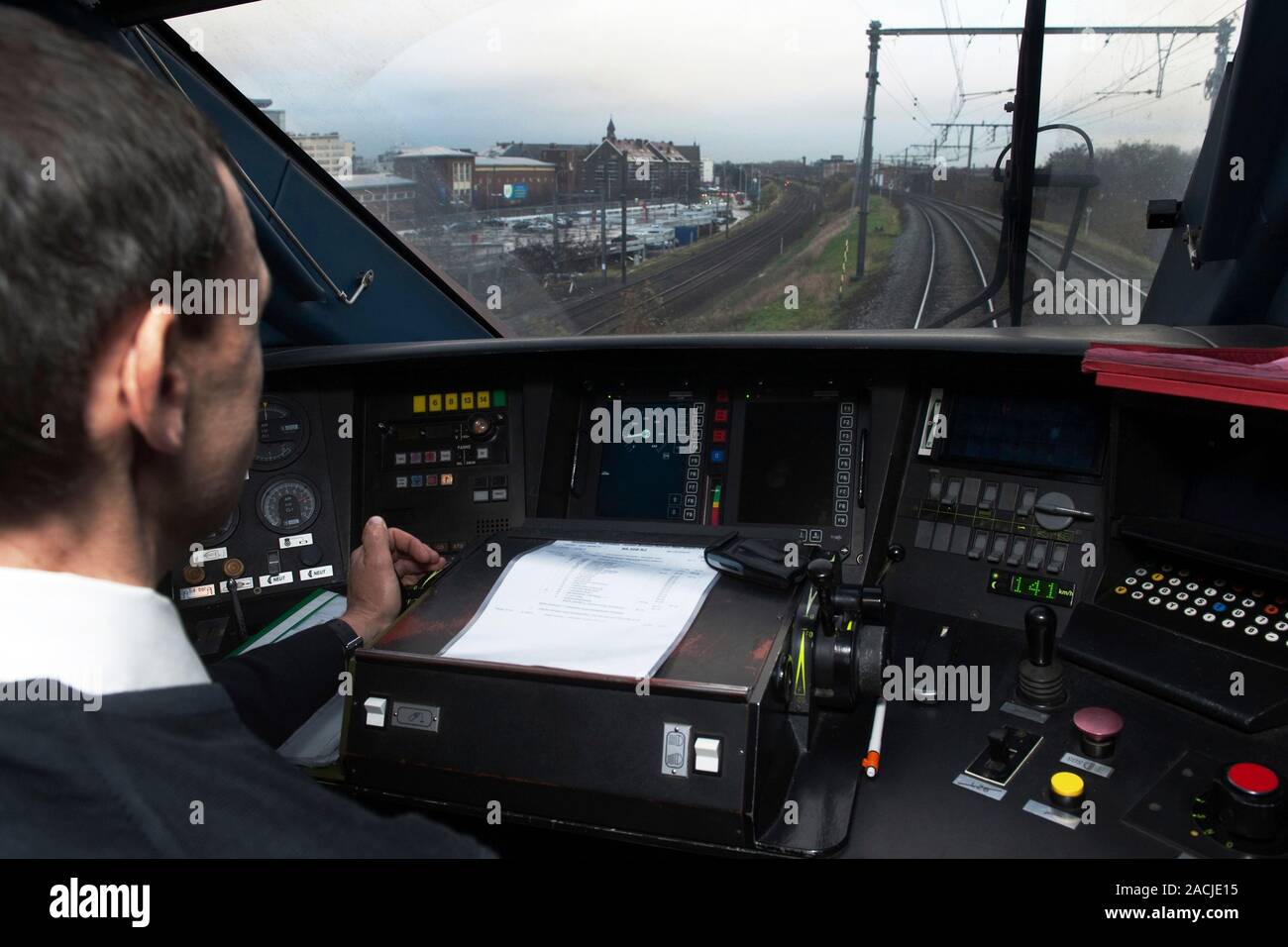 High-speed train. Driver operating a train on the new fast line between ...
