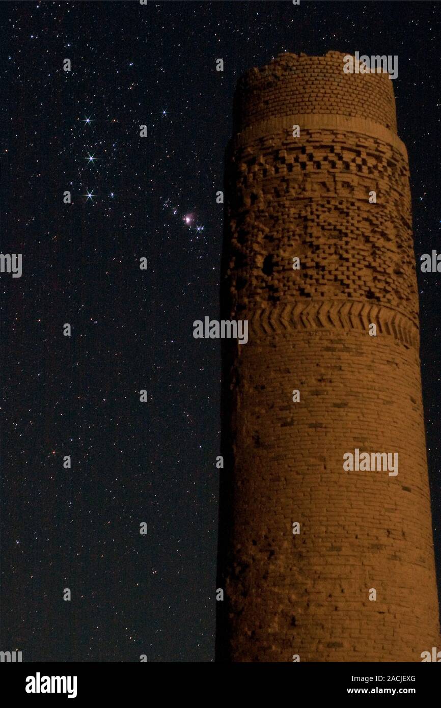 Stars of the Orion's Belt and the Orion Nebula rise above a 1000-year ...