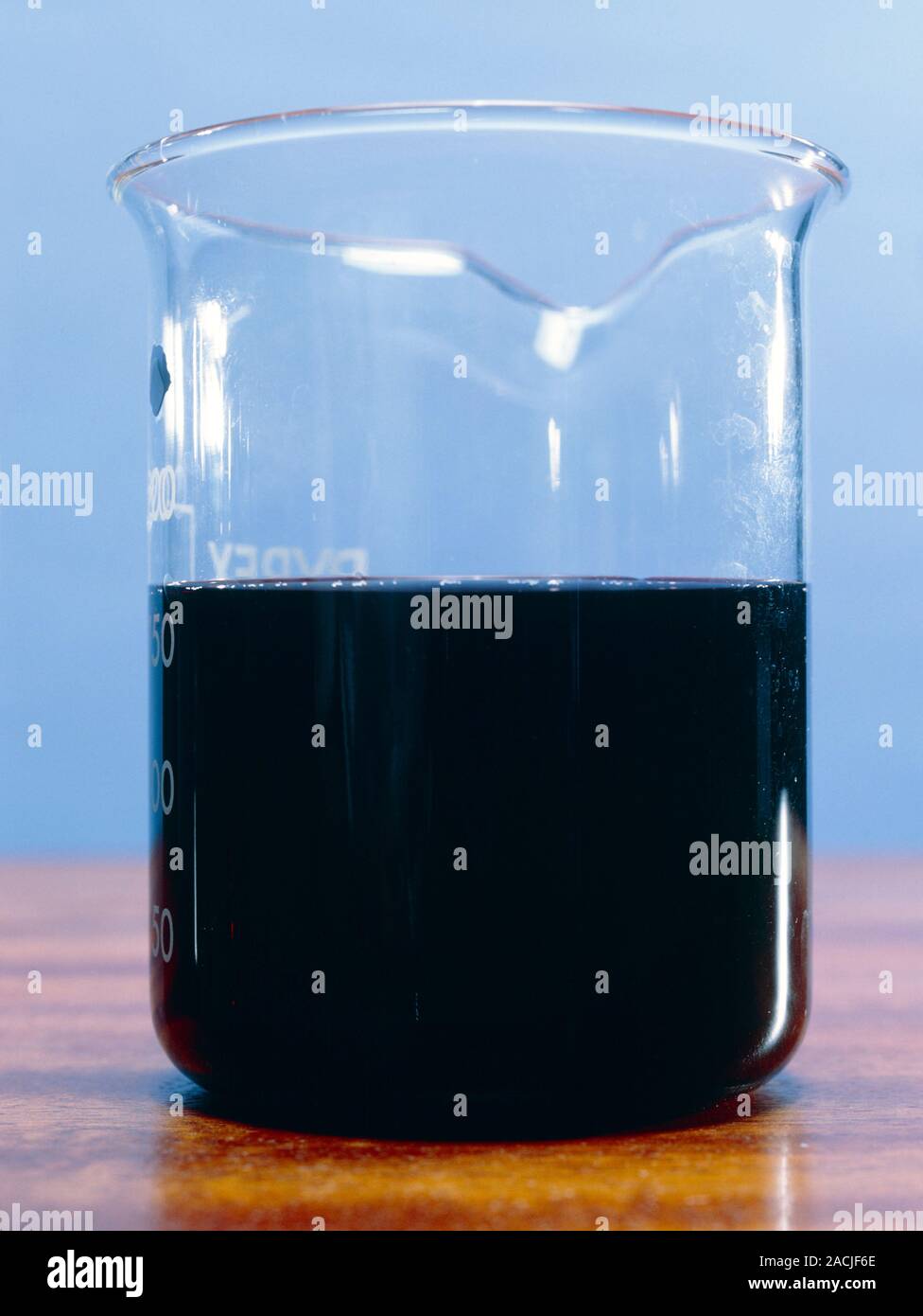 Ink diffusing through water. Black ink one day after being added to a ...