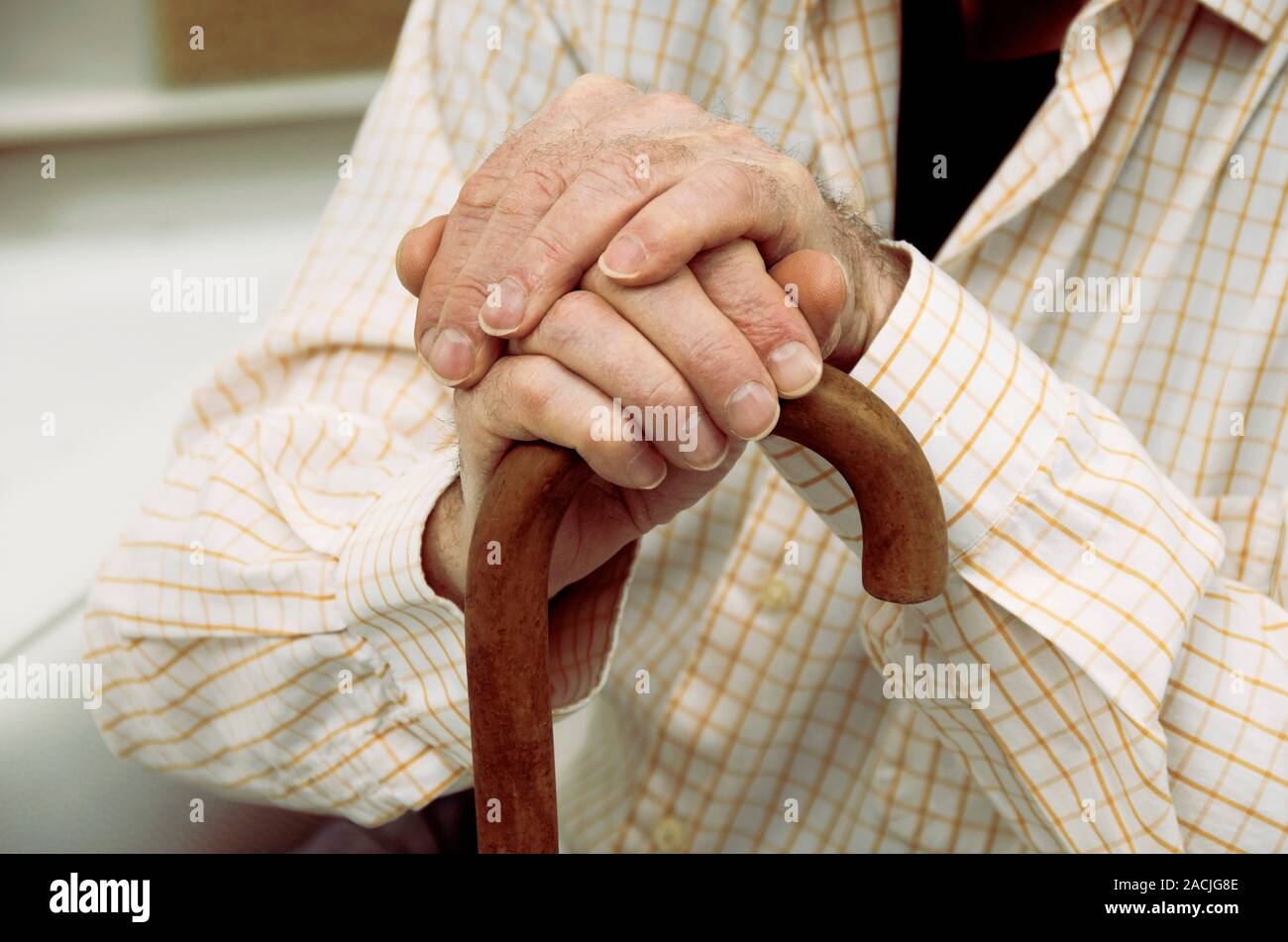 Elderly man holding a walking stick. He is 75 years old Stock Photo - Alamy
