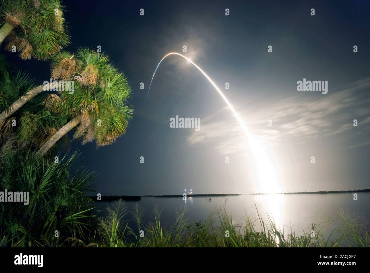 Space shuttle launch. Long exposure photograph showing the rocket trail ...