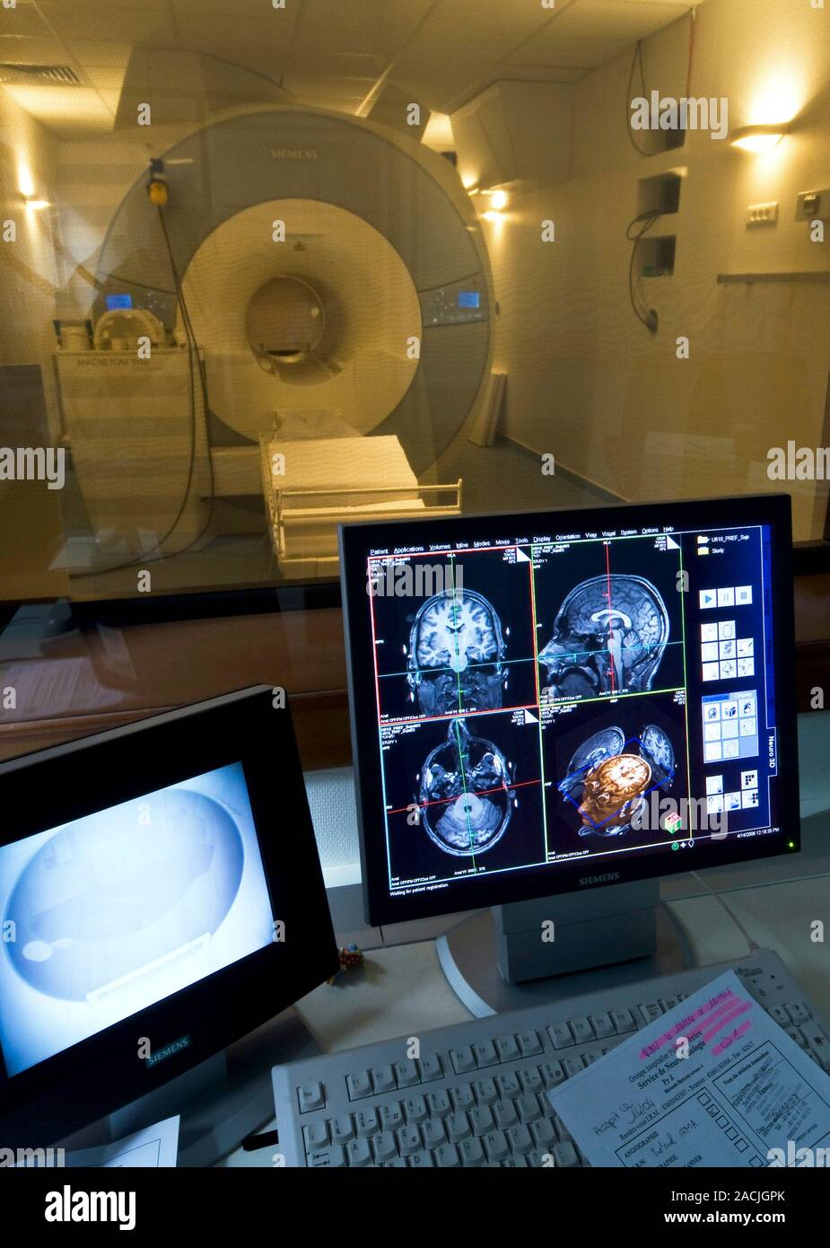 MRI scanner and scans of a patient's brain Stock Photo - Alamy