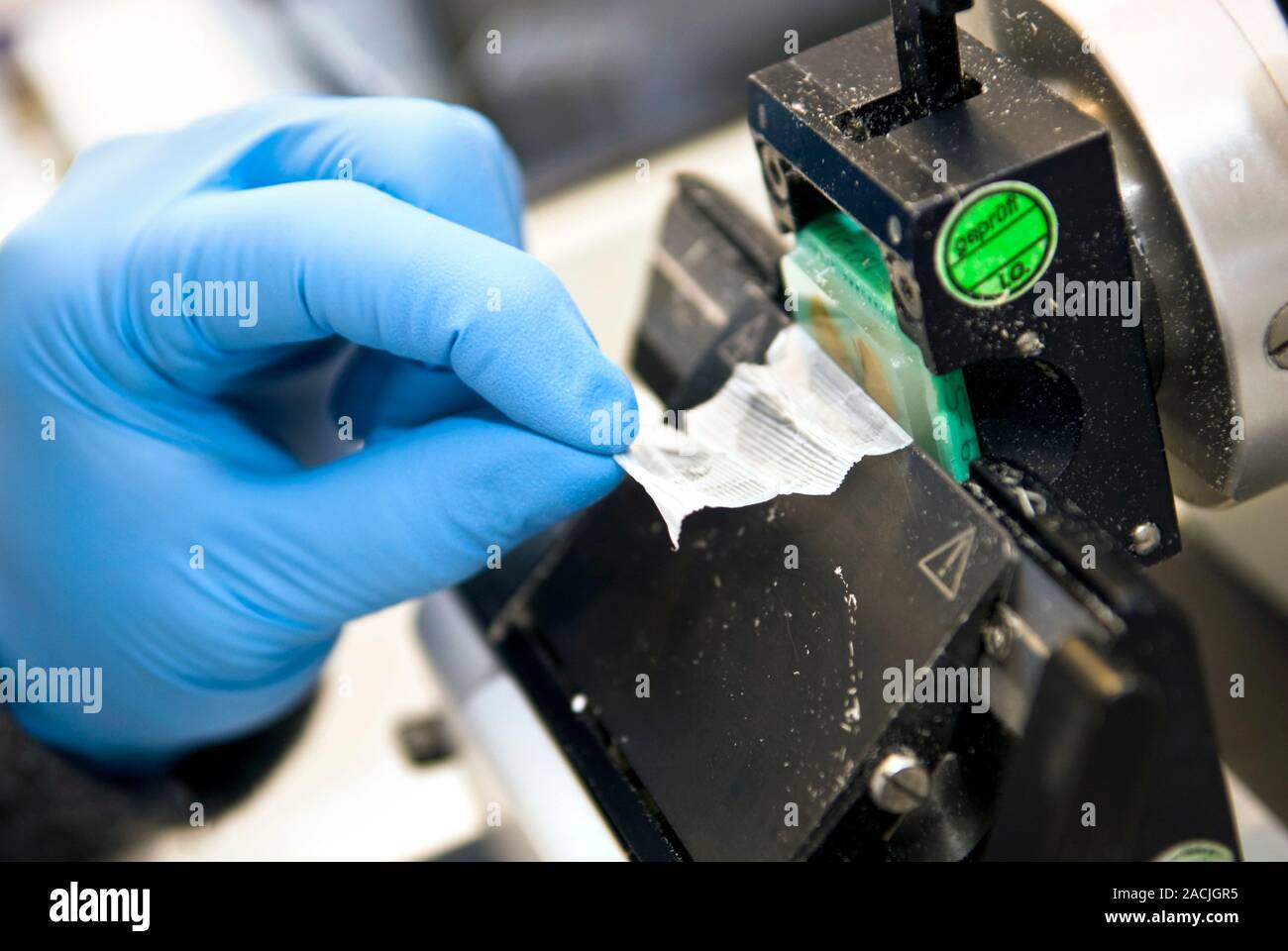 Neuropathology lab. Pathologist preparing samples of brain tissue ...