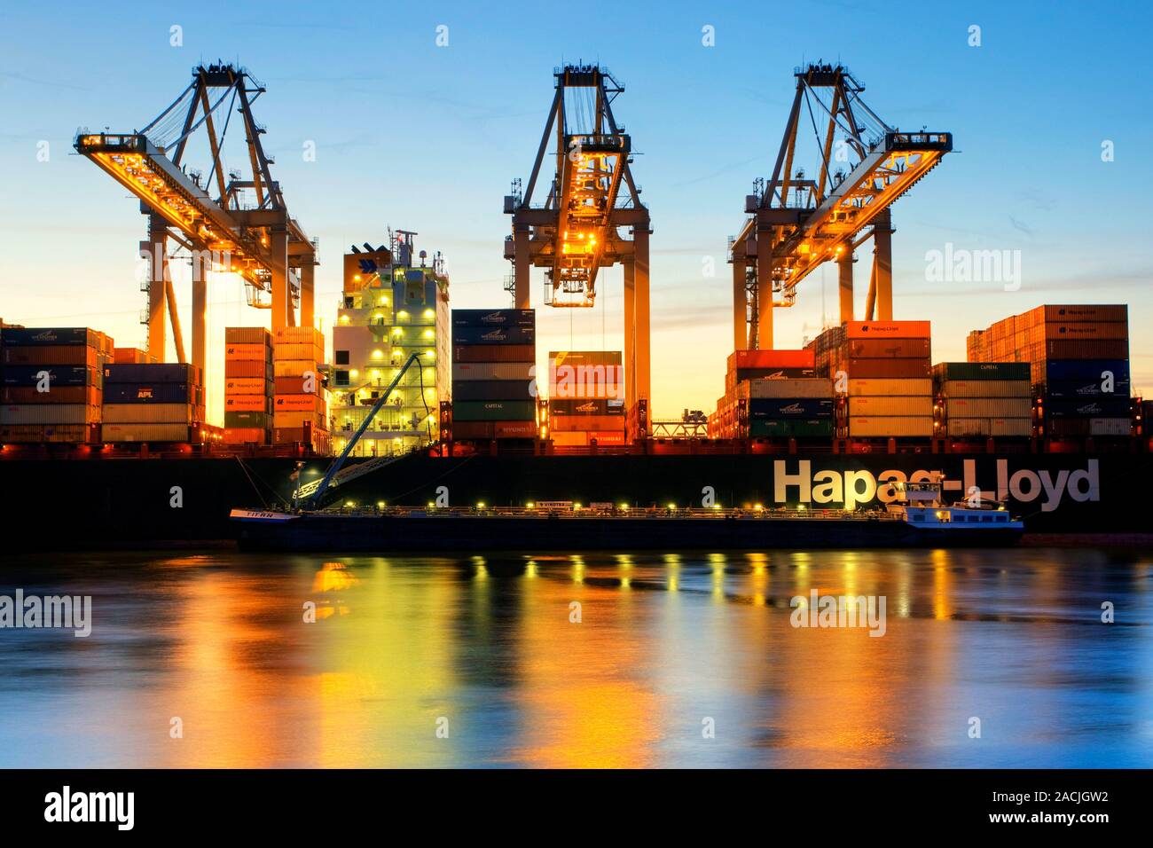 Amazonehaven container ship terminal at night. Ship loaded with ...