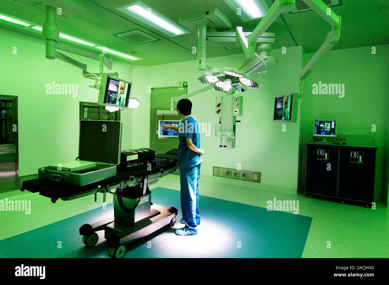 Keyhole surgery training centre. Trainer setting up high-tech training ...