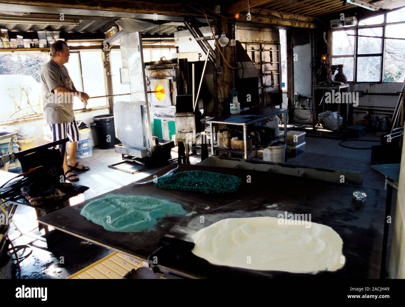 Glassworking. Artisan glassworker in his workshop. Photographed in ...