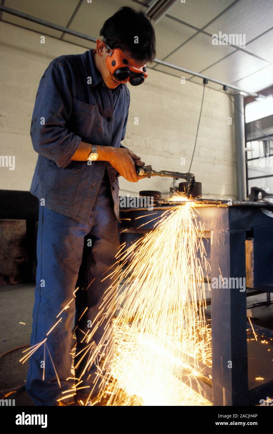 Coppersmith in his workshop. Photographed in France Stock Photo - Alamy