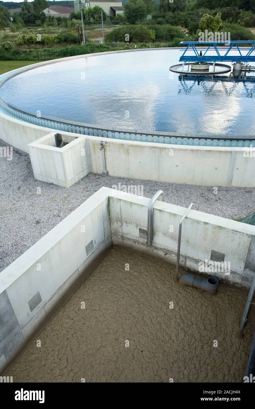 Water treatment works. View of the sedimentation tank (top) at a water ...