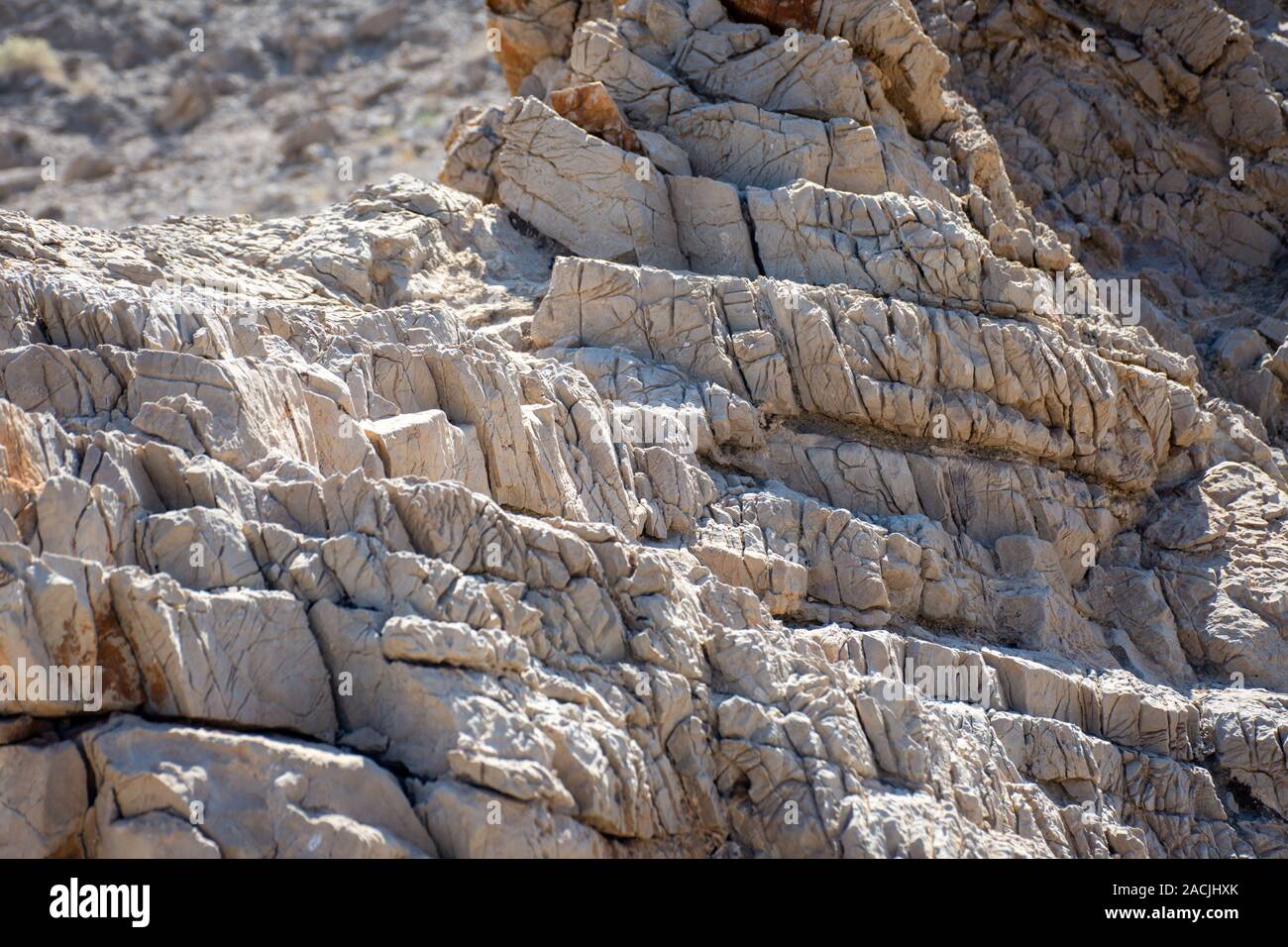 Geological textured cliff face showing years of sand and wind erosion ...