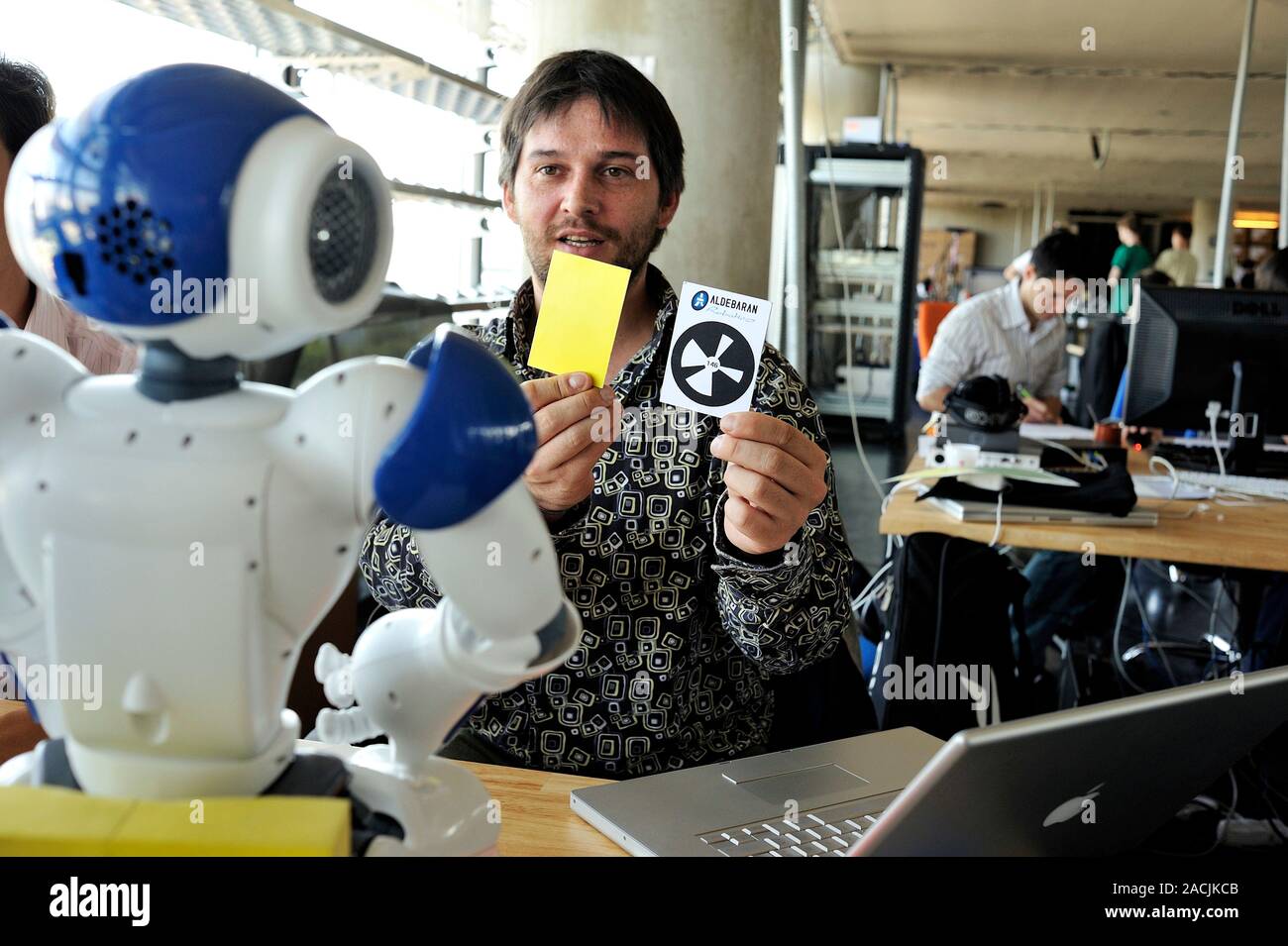 Robotics lab. Roboticist working with Nao, an autonomous humanoid robot ... Robotics lab. Roboticist working with Nao, an autonomous humanoid robot ...