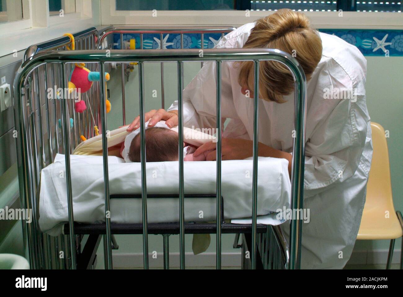 Maternity ward. Nurse with a baby on the maternity ward of a hospital ...