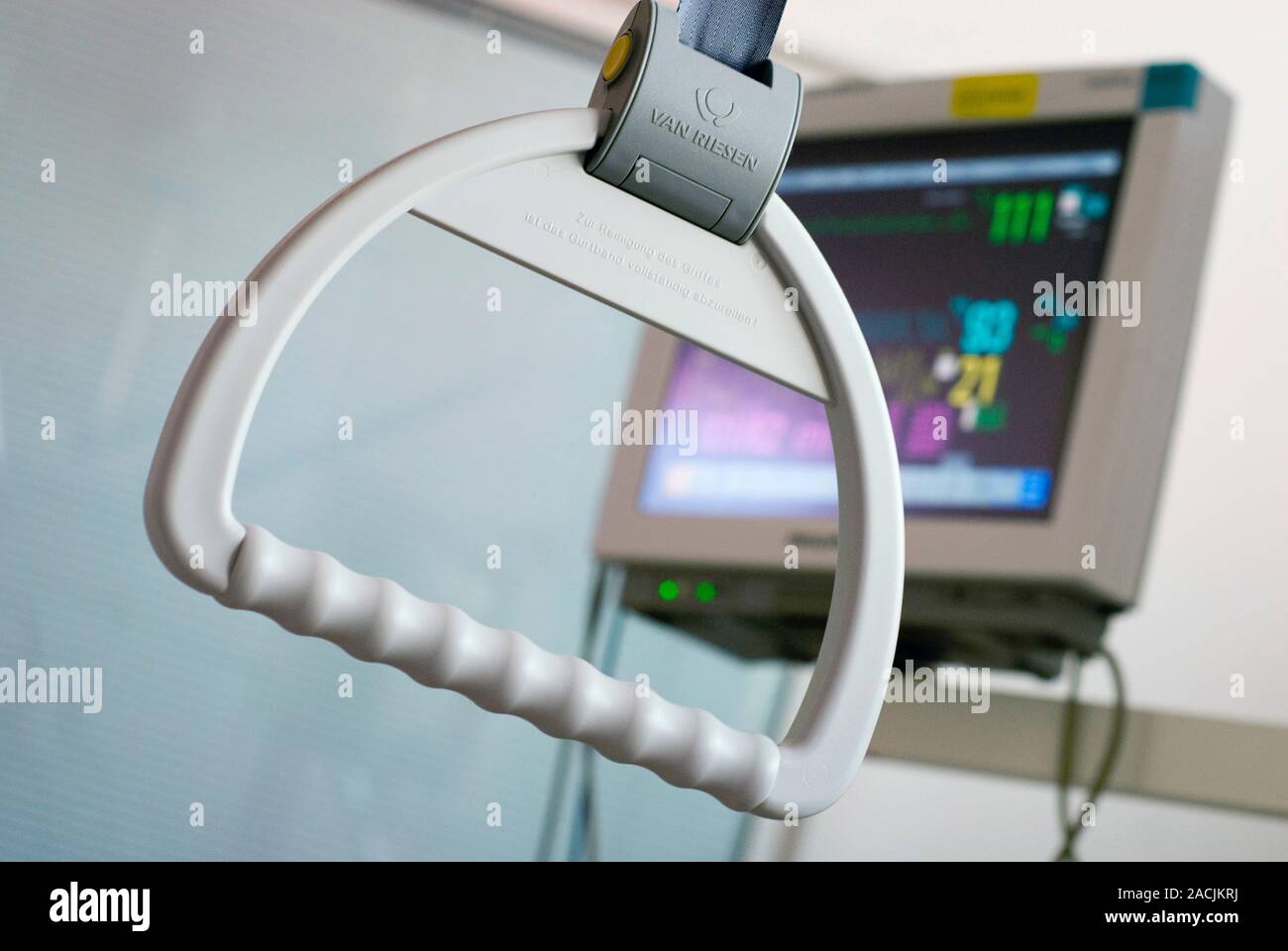 Intensive care unit. Handle hanging above a patient's bed in a hospital ...