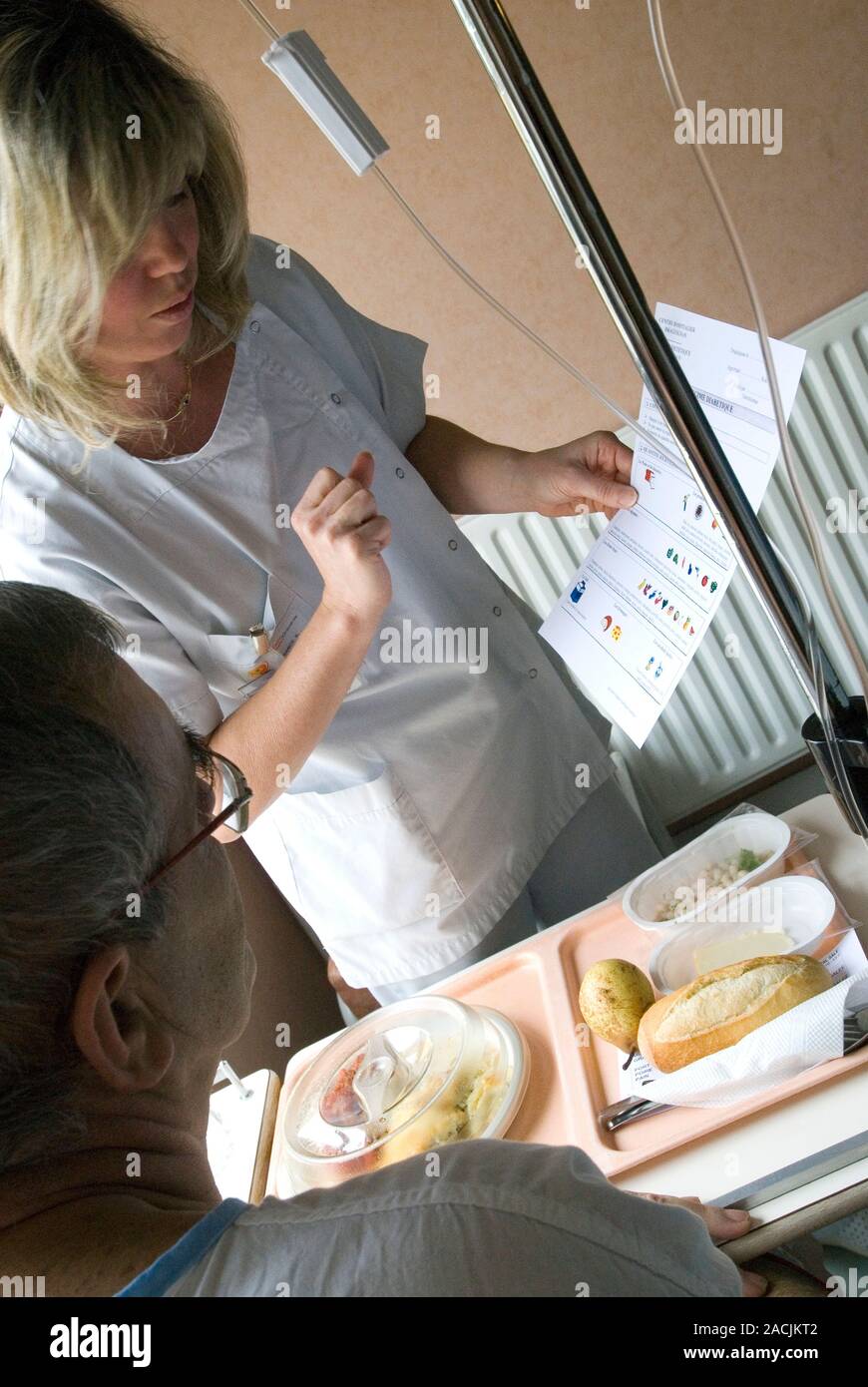 Hospital nutrition. Dietician working with a newly arrived hospital ...