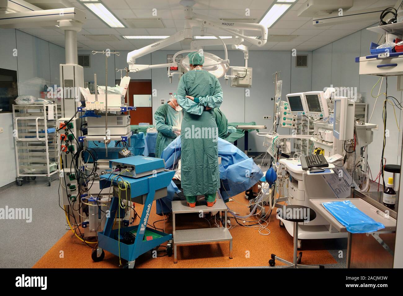 Operating theatre. Surgical team operating on a patient Stock Photo - Alamy