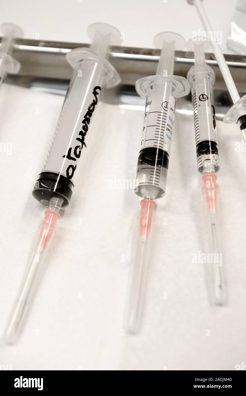 Medical syringes in an operating theatre Stock Photo - Alamy