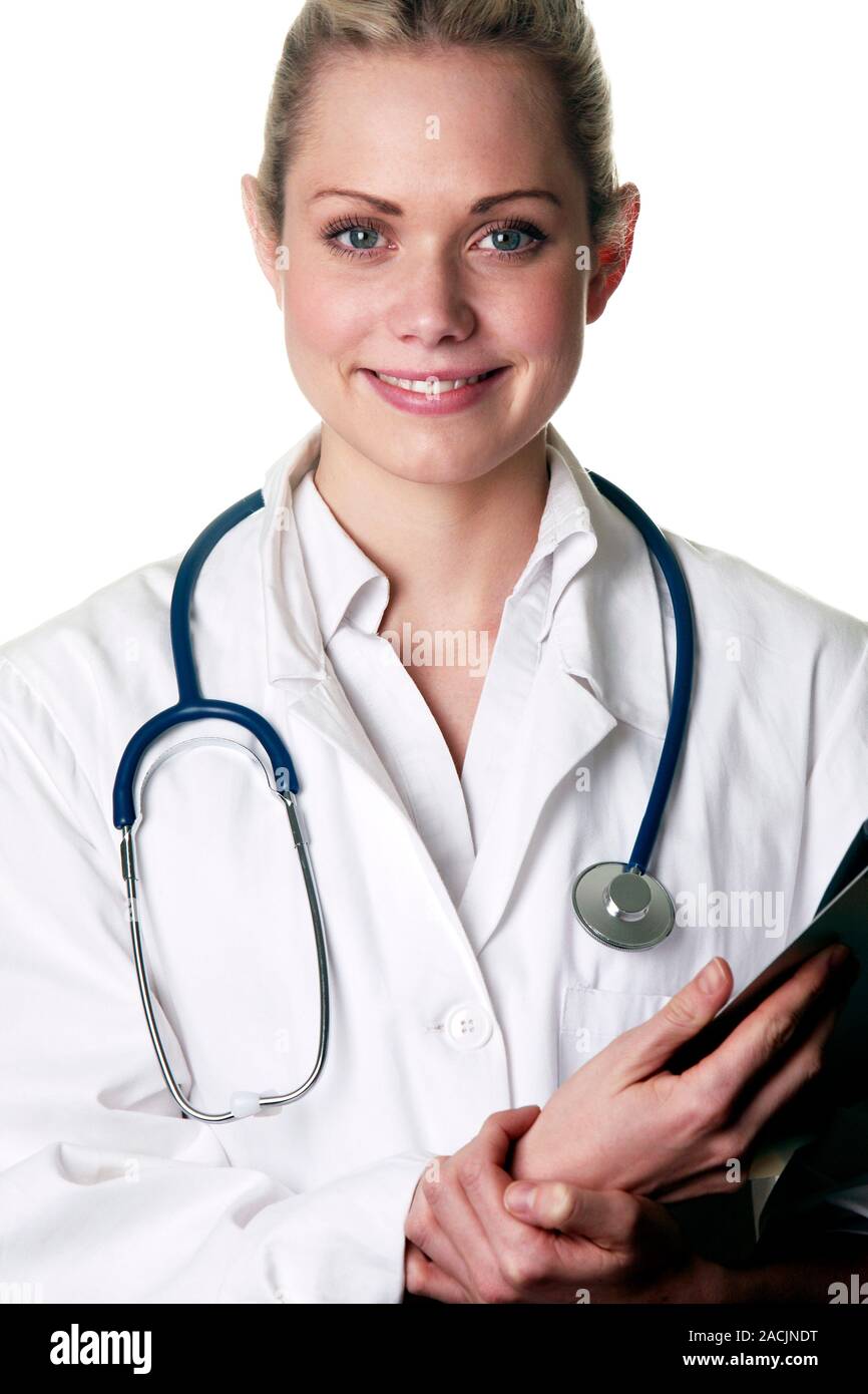 Smiling doctor holding patient notes Stock Photo - Alamy