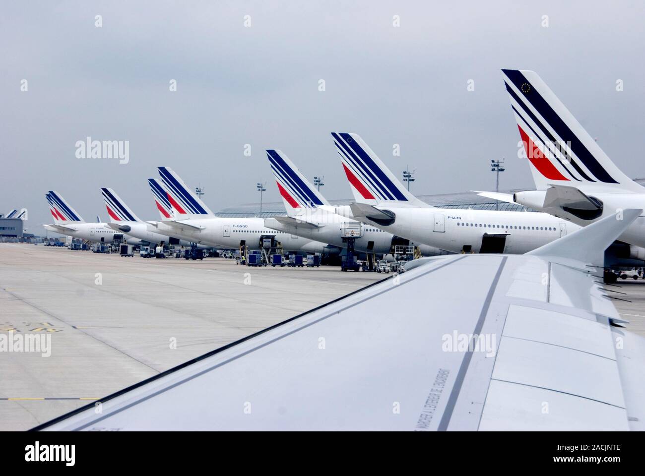 A row of aircraft at the gates at Charles de Gaulle airport, Paris ...