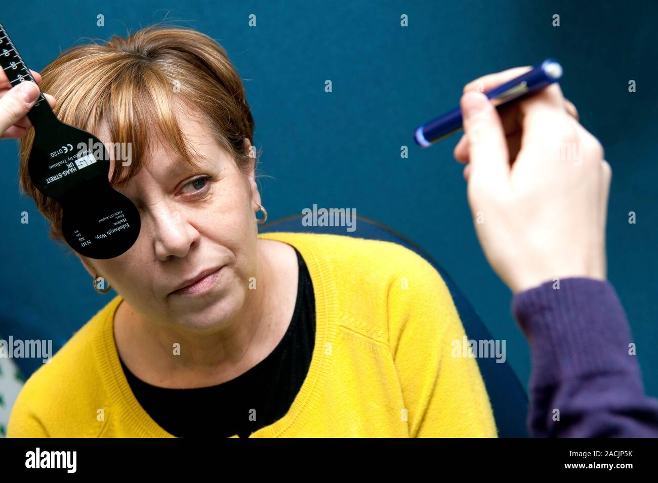Eye test. Patient undergoing an eye test in a hospital ophthalmology ...