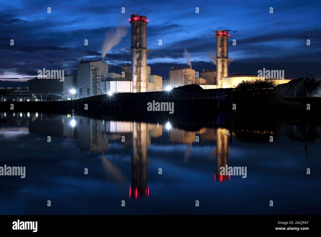 Combined cycle gas turbine (CCGT) power station at night. This is the ...