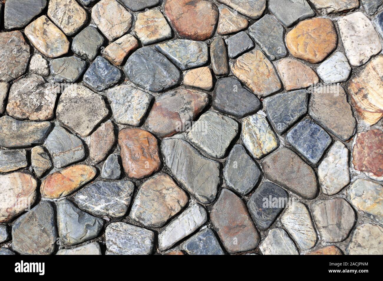 Texture of ancient paving stone of different colors Stock Photo - Alamy