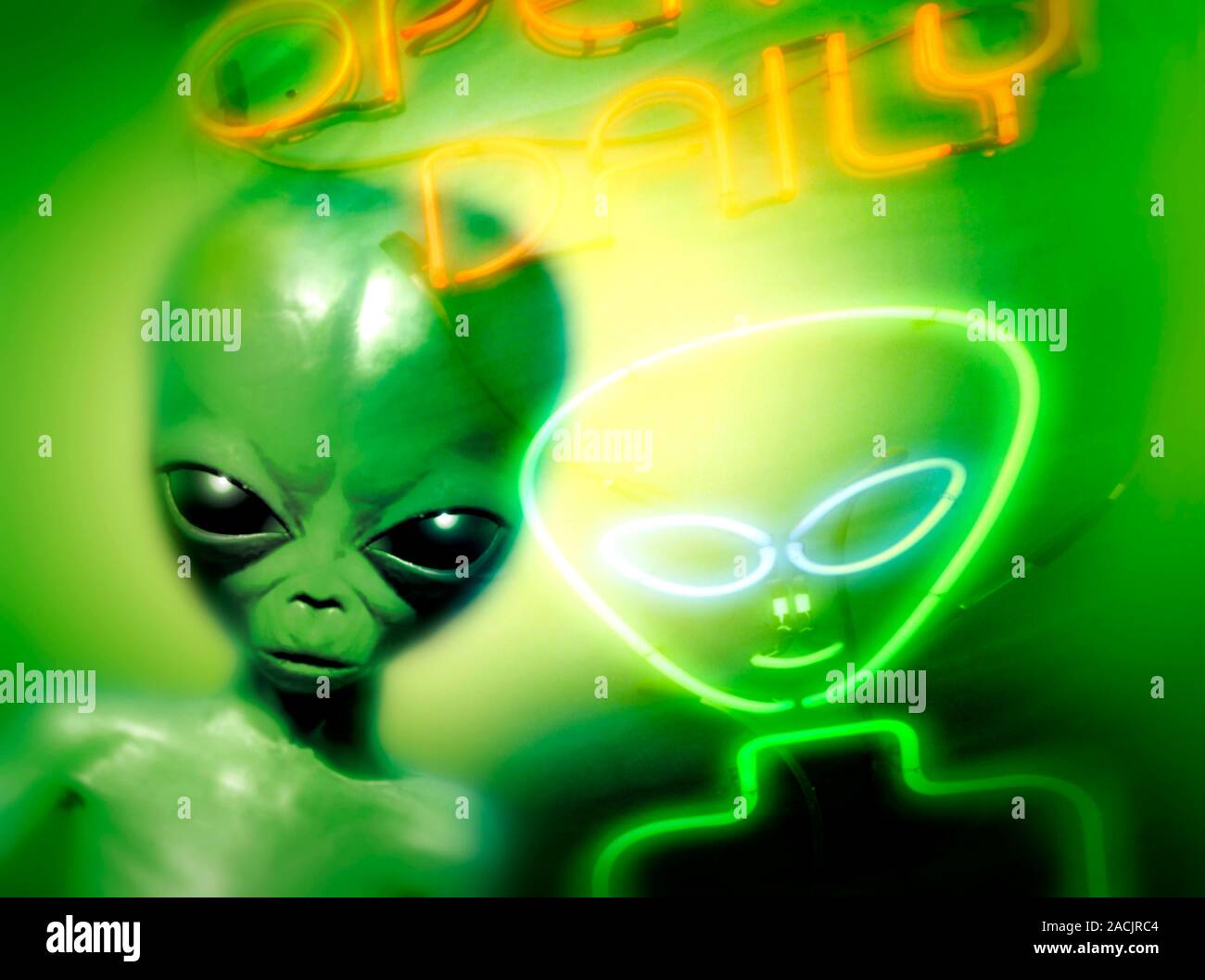 Alien visiting Earth. Computer artwork of a humanoid alien looking at a ...