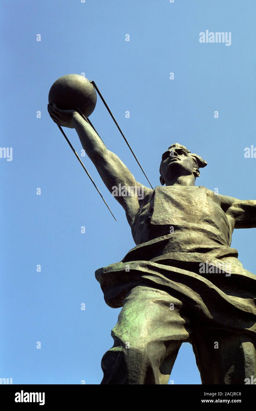 Soviet spaceflight monument. Statue of a steelworker holding the ...