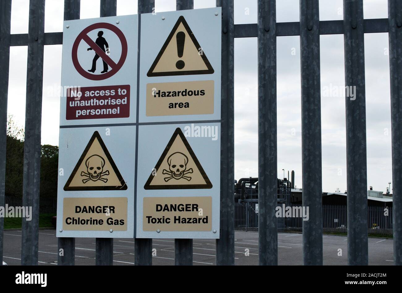 Warning signs outside industrial plant that handles dangerous and toxic ...