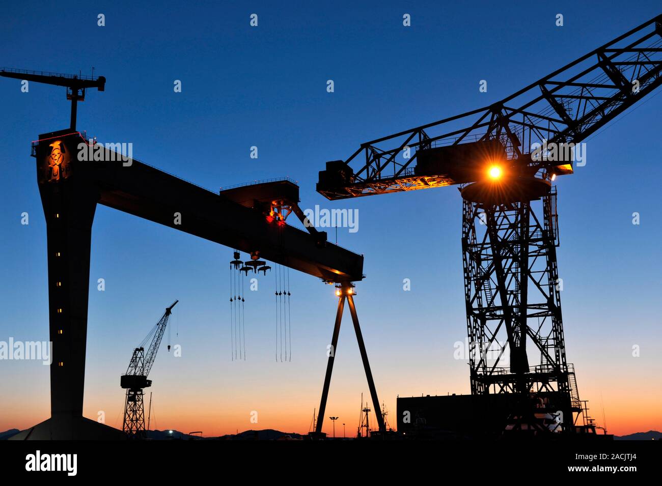 Shipyard at night. Boat lifts at a shipyard at night. Photographed in ...
