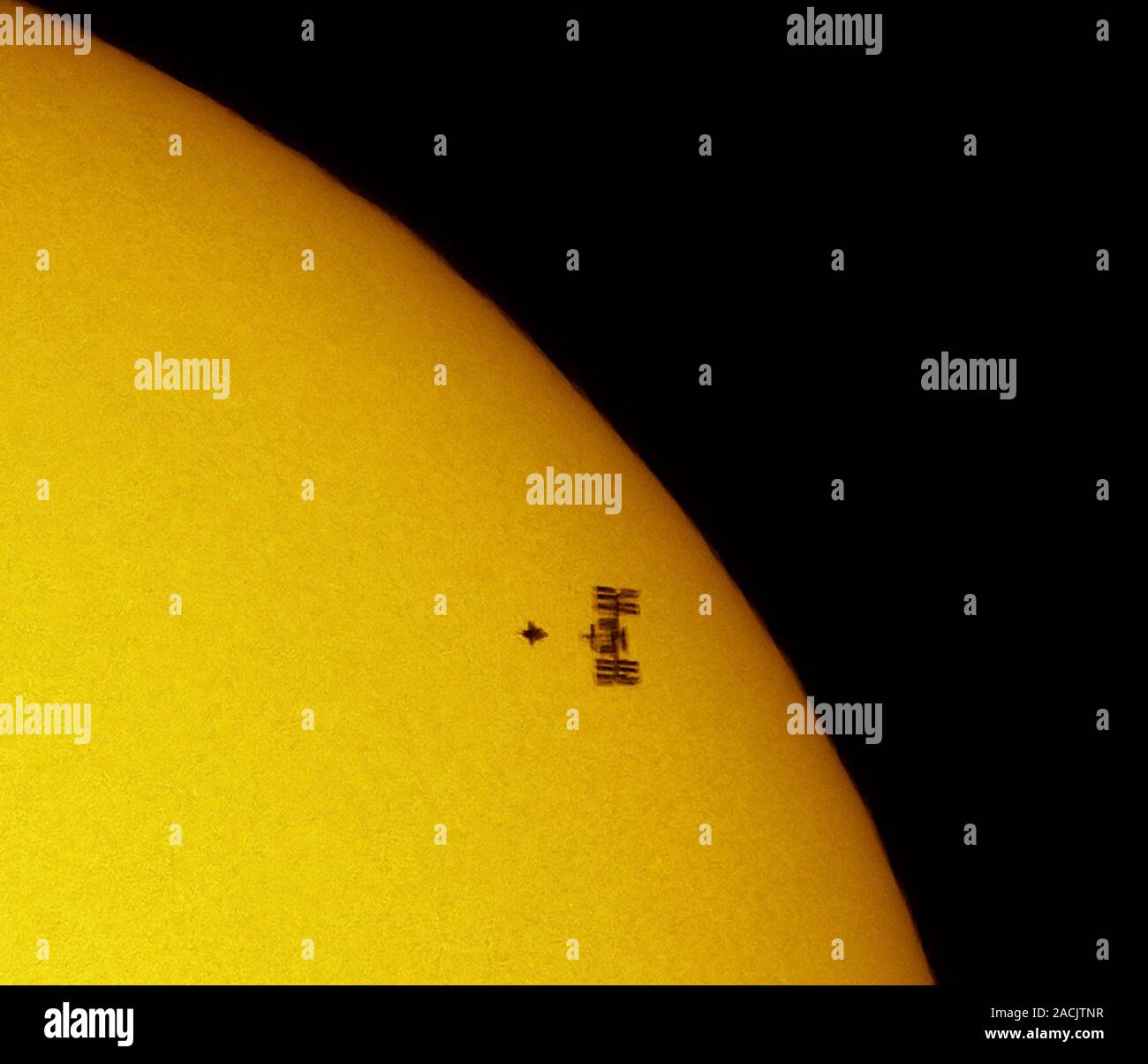 ISS and Atlantis against the Sun. Silhouette of the Space Shuttle ...