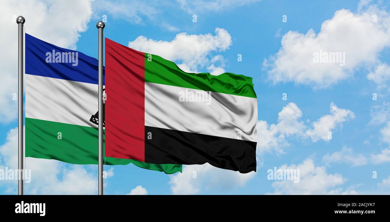 Lesotho and United Arab Emirates flag waving in the wind against white ...