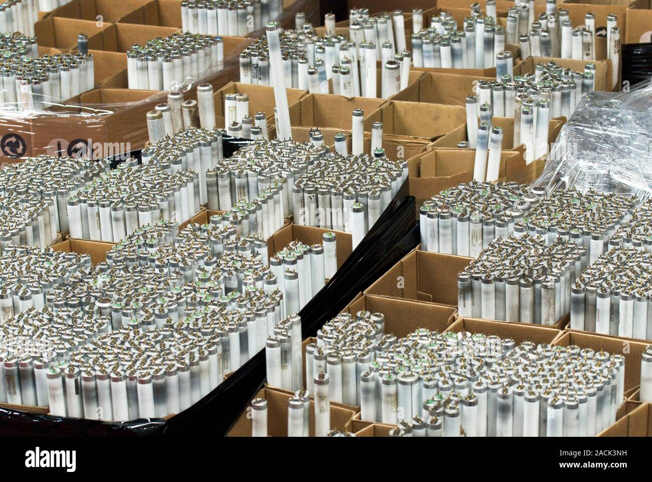 Light bulb recycling plant. Boxes of used fluorescent light tubes ...