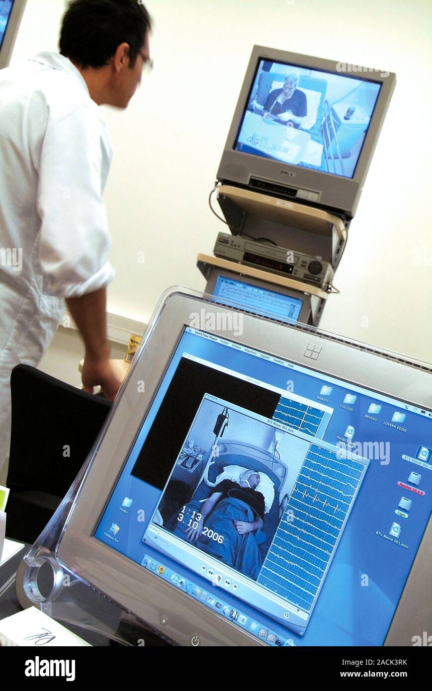 Neurological testing. Neurologist monitoring an epileptic patient ...