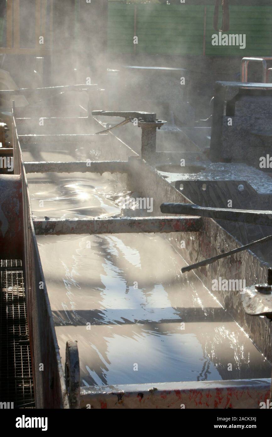 Geothermal well construction site. Vats of hot mud at the site of a ...