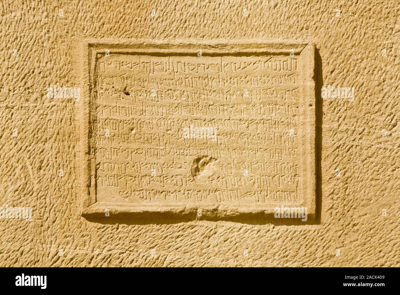 Mada'in Saleh. Engraved writing over the doorway of a rock tomb in the ...