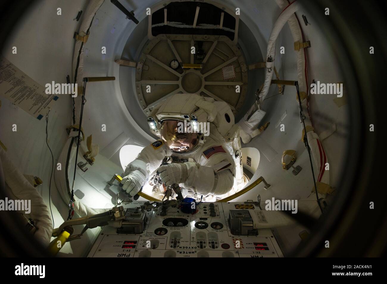 Mission STS-133 space walk. NASA astronaut Alvin Drew moving through the Quest airlock on the ...
