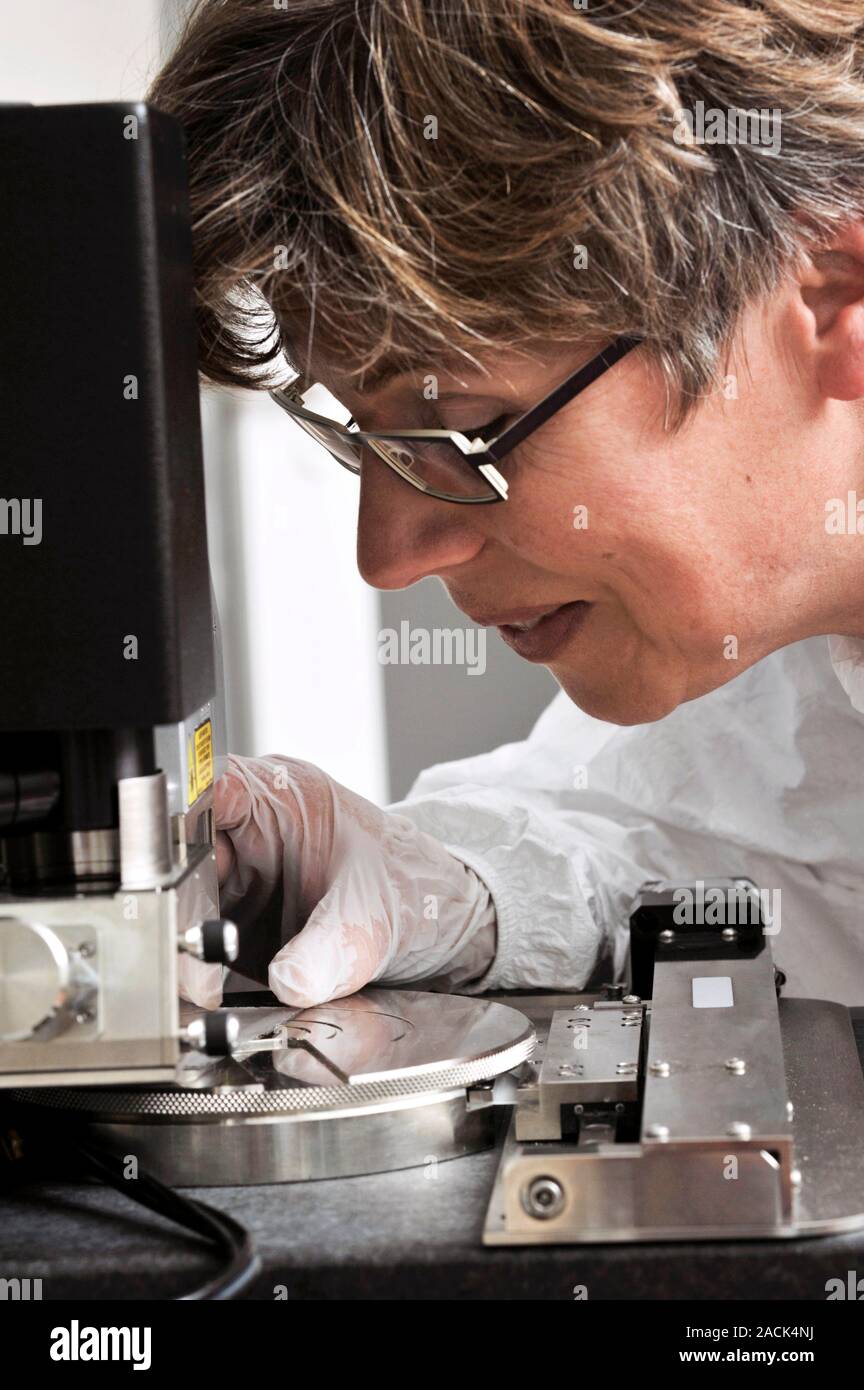 Atomic Force Microscope Scientists Loading A Sample Into An Atomic