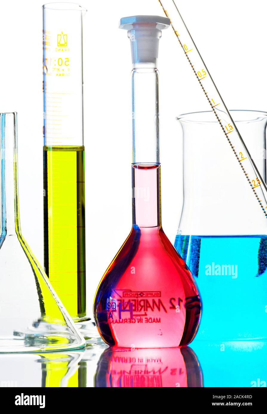 Chemistry glass-ware containing coloured liquids Stock Photo - Alamy