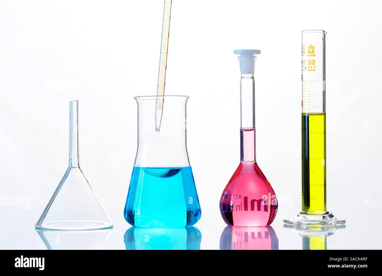 Chemistry glass-ware containing coloured liquids Stock Photo - Alamy
